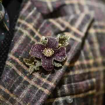 Coat with brooch store