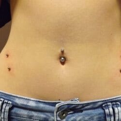 hip piercing scars